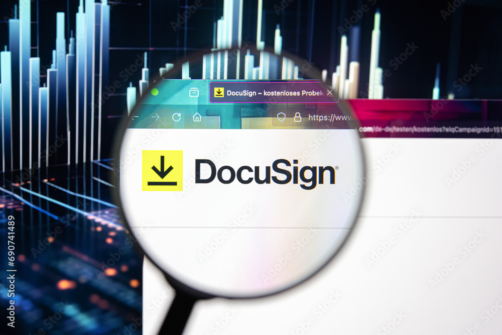 DocuSign company logo on a website with blurry stock market developments in the background, seen ...