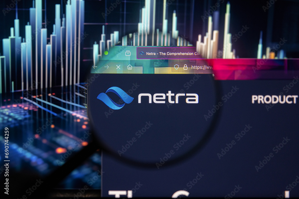 Netra company logo on a website with blurry stock market developments ...