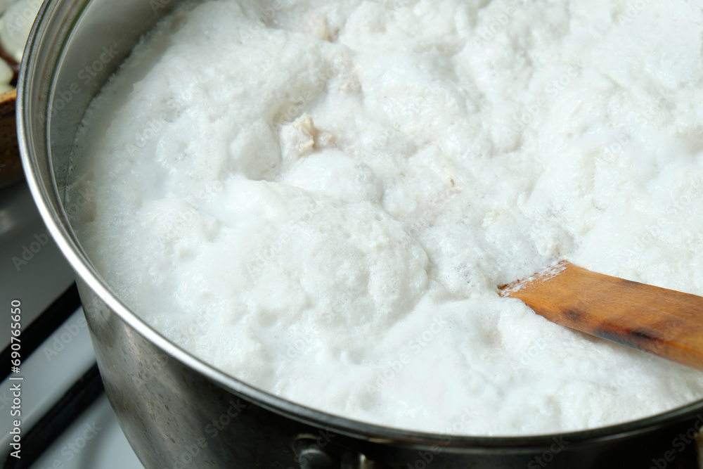 Foam from cooking chicken. Boiling water in a pan Stock Photo | Adobe Stock