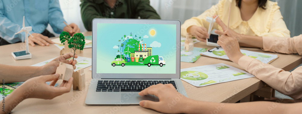 Green city and waste management illustrate displayed on laptop ...