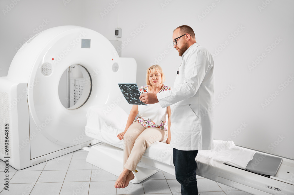 Medical computed tomography or MRI scanner. Doctor holding and ...