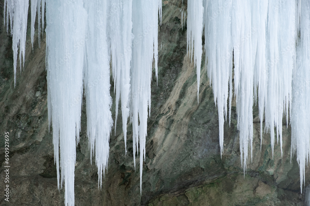 Icicles waterfall. Freezing of water in the river in winter. Majestic ...