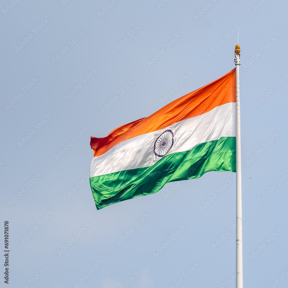 India flag flying high at Connaught Place with pride in blue sky, India ...