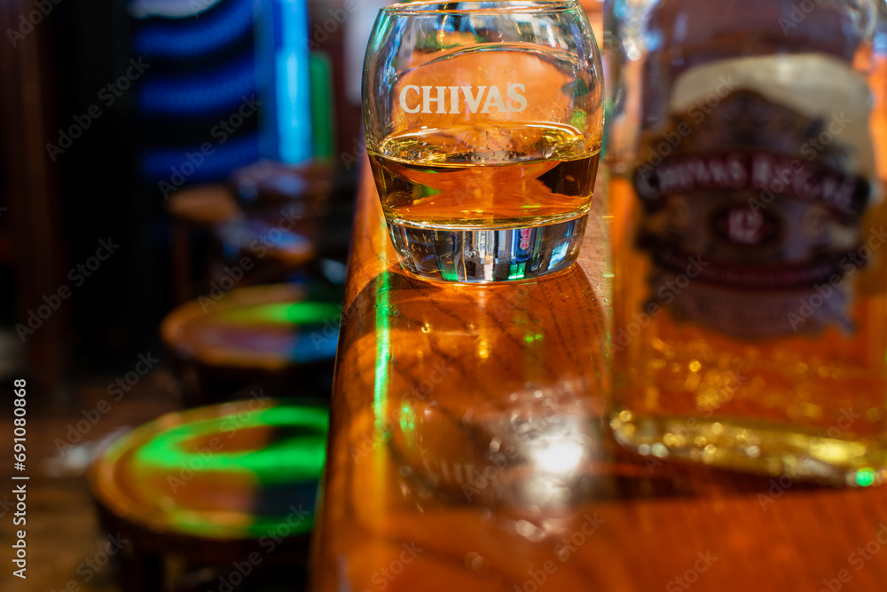 Glass of blended scotch whisky Chivas Regal 12 years aged close-up on ...
