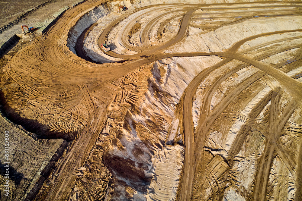 Aerial view of the patterns of roads on a sand quarry. Extraction of ...