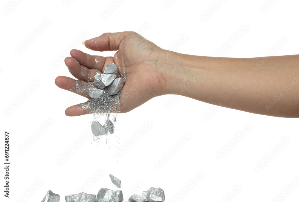 Silver ore nugget fall from industrial Miner hand fingers. Many pieces ...