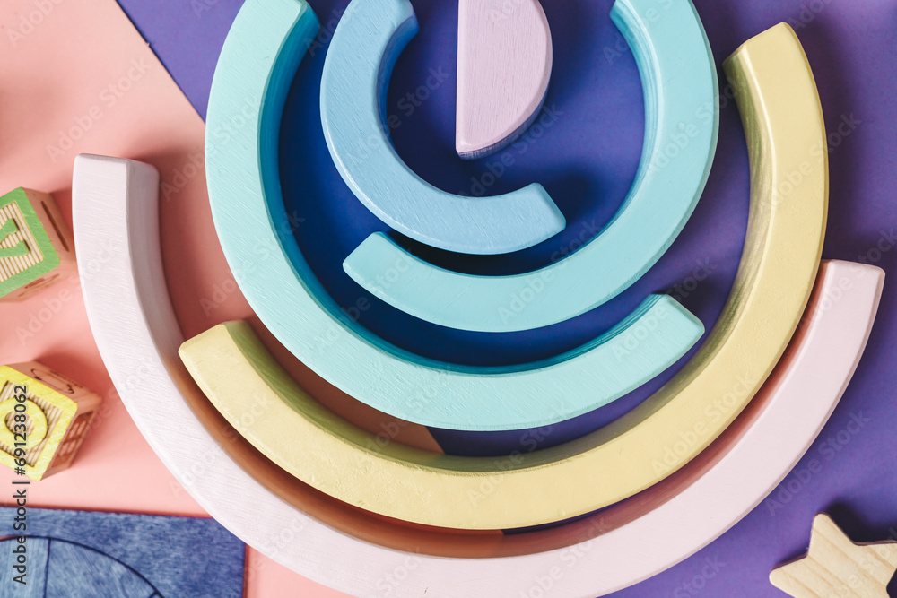 background with circles. Wooden kids toys on colourful paper ...