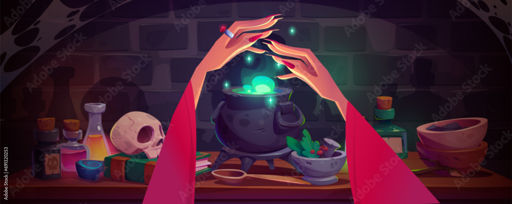 Witch hands conjuring over cauldron with brewing green glowing potion ...