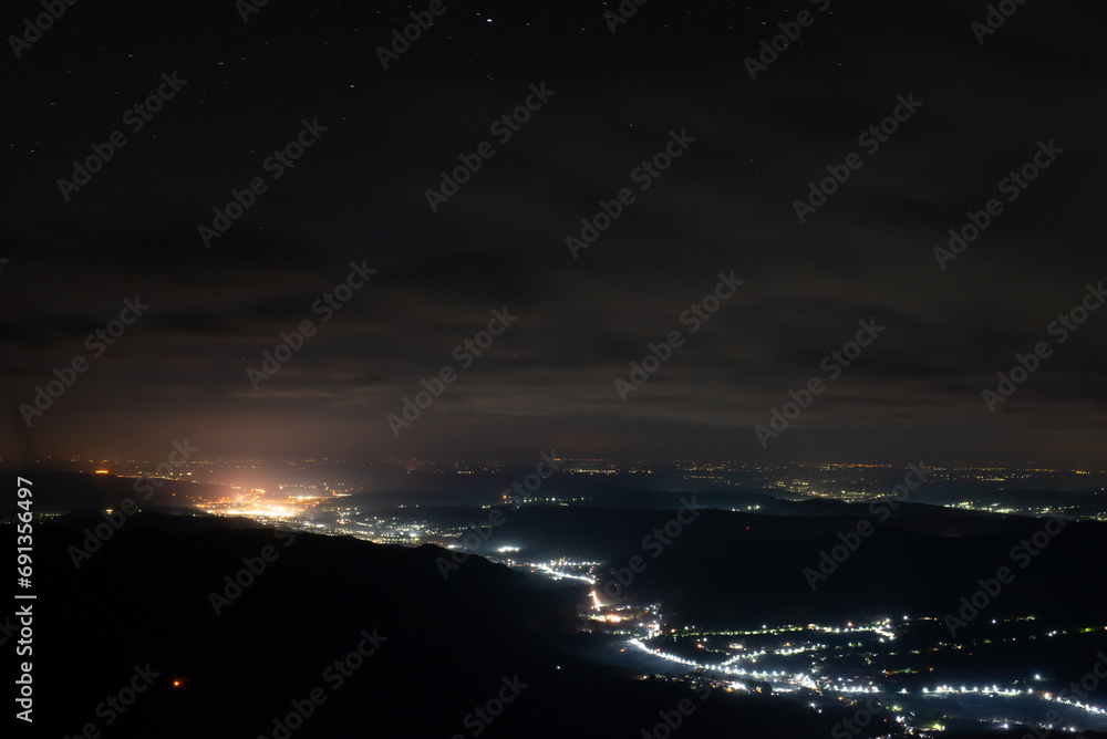City lights seen from above. Light pollution covering the night sky ...