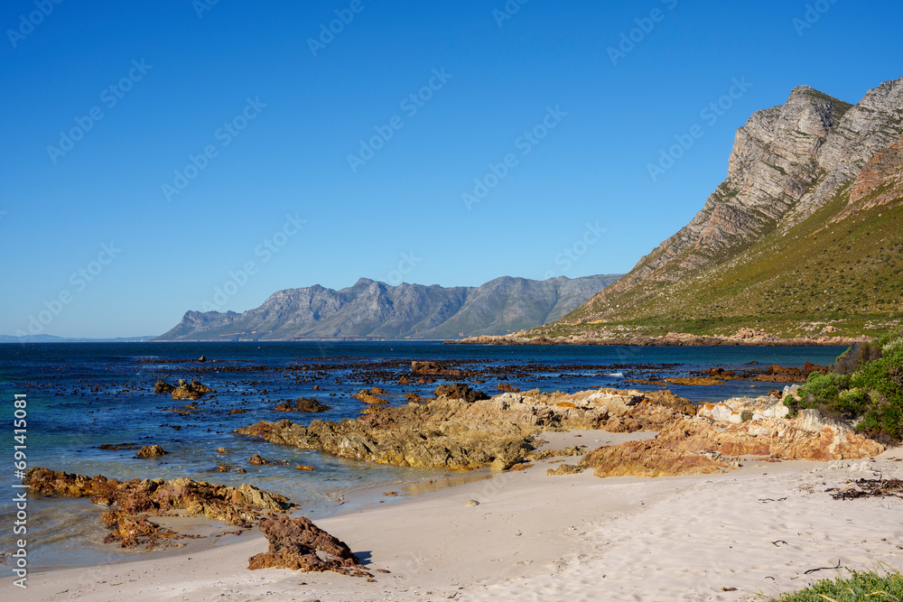 View of the gorgeous Rooi Els beach with the Kogelberg Mountains and ...