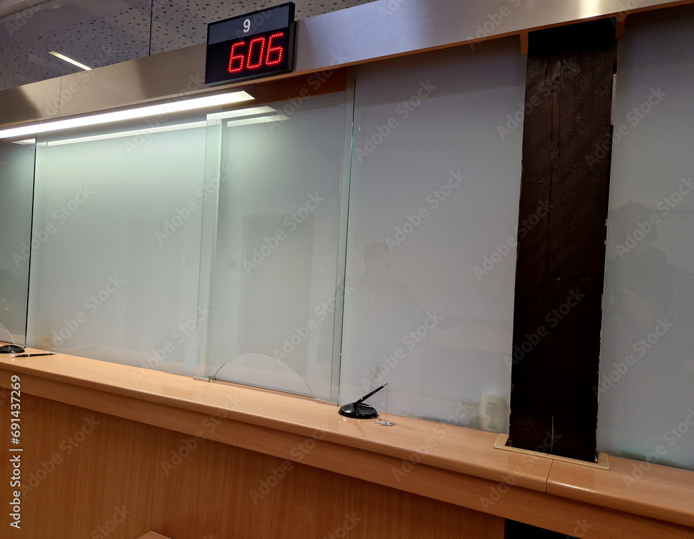 you will come to an office room with partitions made of opaque glass ...