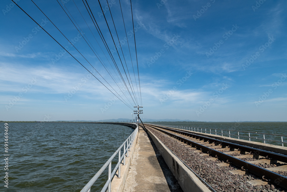 Floating train on Pasak Jolasid dam at Khok Salung Train Station in ...