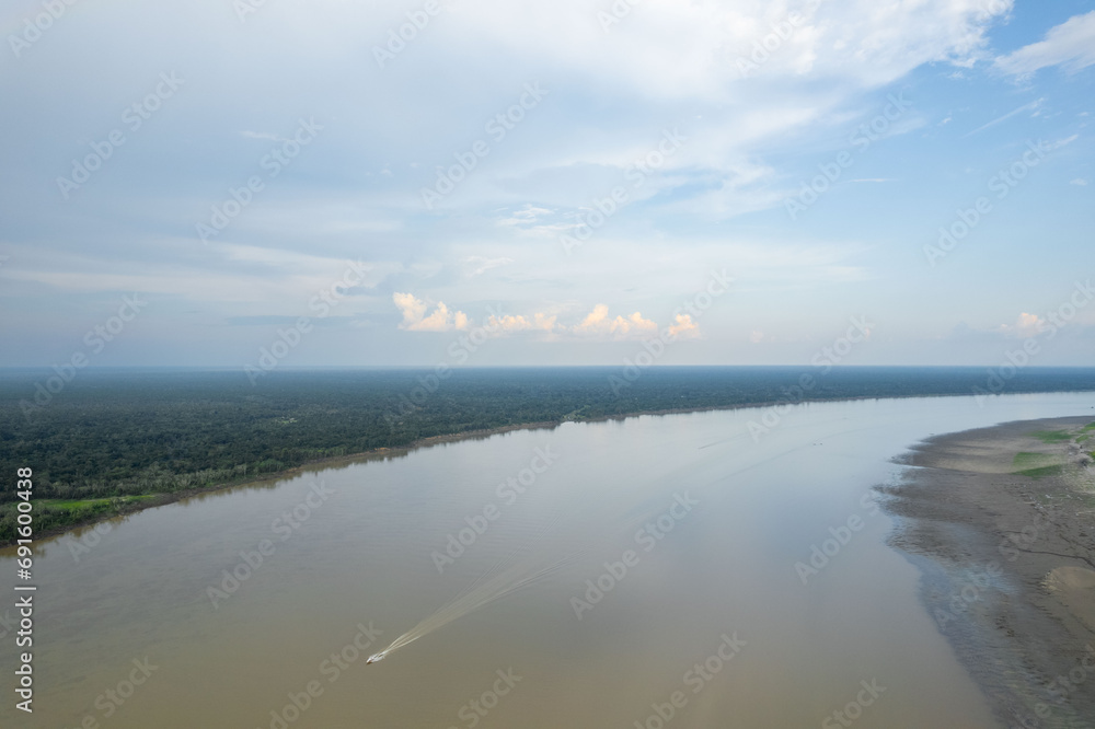 Aerial view of the Amazon river. Boat cruising in the middle Stock ...