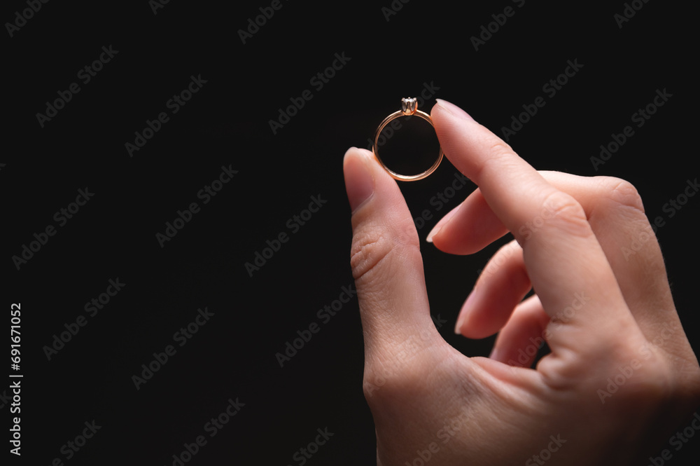 Poster ring is held with the fingers, demonstrating the diameter of the ...