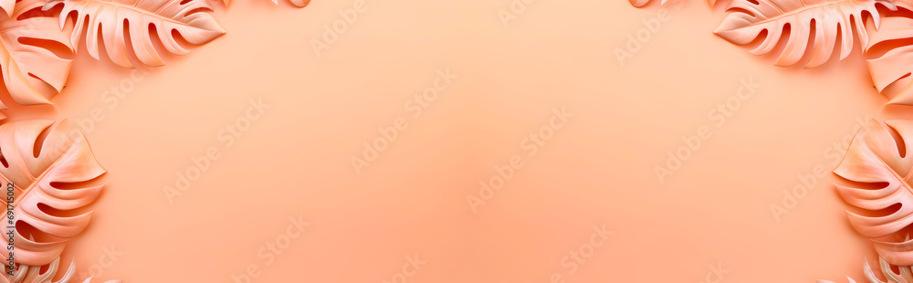 Border frame of peachy pastel tropical monstera leaves on peach fuzz ...