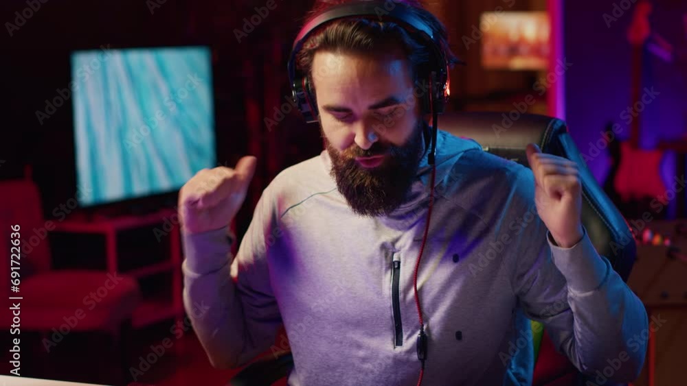 Professional player competing in videogame tournaments online while ...
