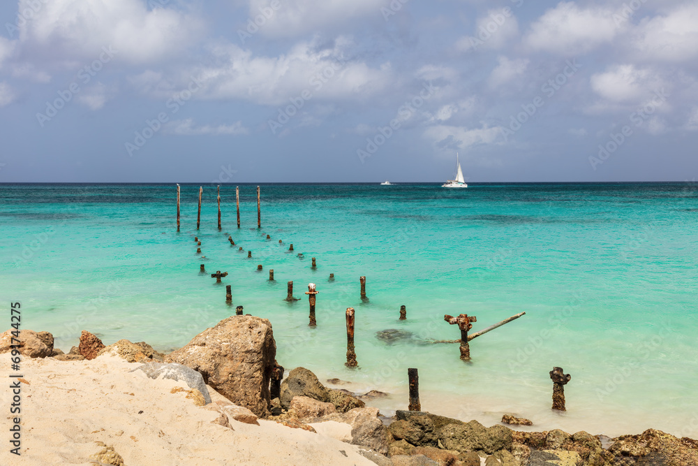 Tropical beach on the island of Aruba. Sandy beach in foreground ...