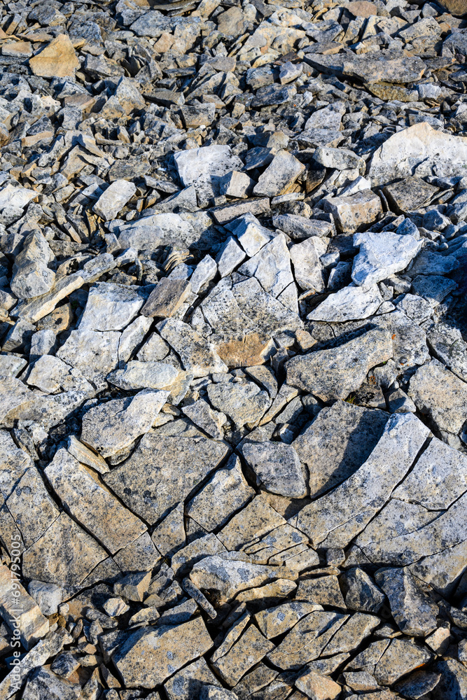 Rocks broken up by weather patterns of freeze and thaw, Kinnvika ...