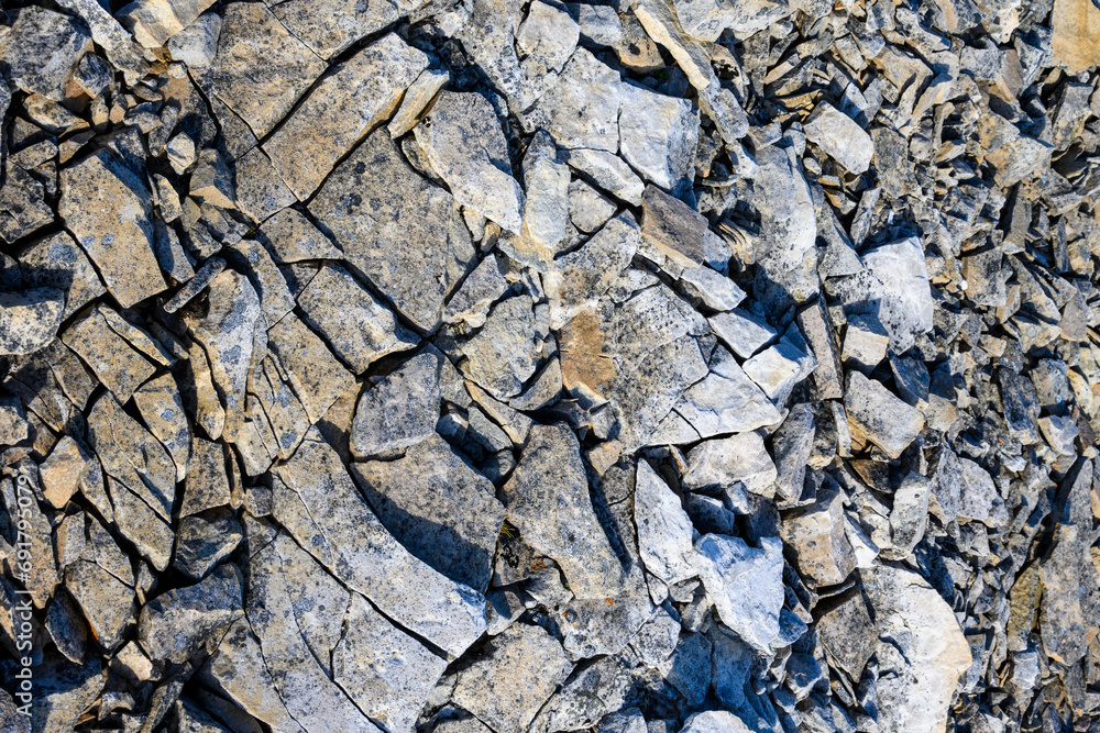 Rocks broken up by weather patterns of freeze and thaw, Kinnvika ...