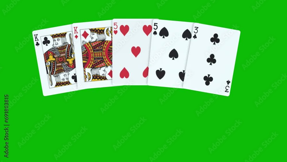 A poker hand consisting of two pairs with cards thrown one by one on ...