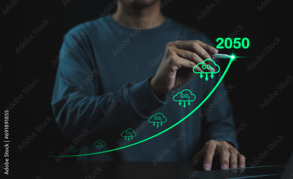Carbon reduce emission concept. Businessman point to increasing arrow with carbon reduction for ...