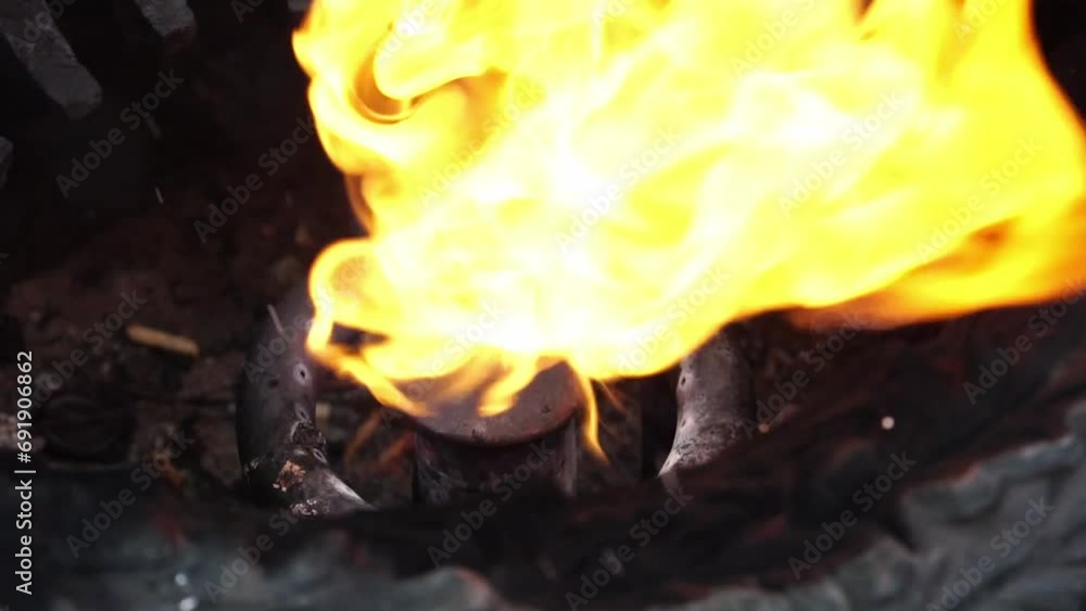 Red flame in close-up. Natural gas as a source of fire and heat. A ...