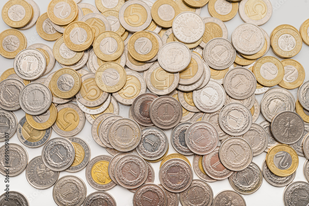 Polish Zloty coins. 1, 2 and 5 PLN coin background on the white table ...