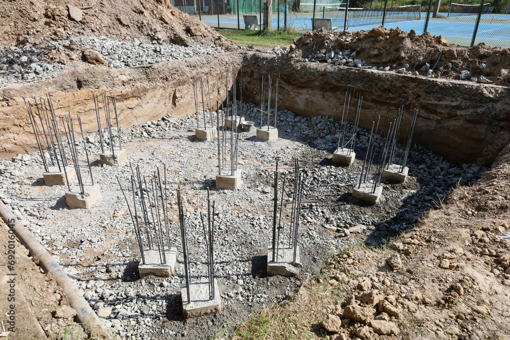 Pile foundation pit. Concrete pier with rebar in outdoor pit for ...