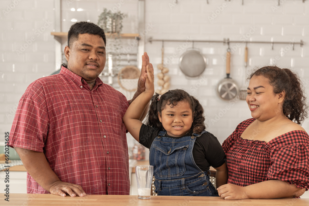 Foto de A chubby family with a father wearing a prosthetic. They were ...