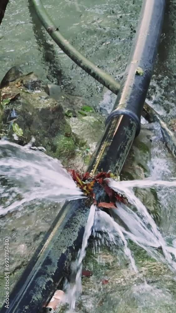 Breakdown captured Water bursts from pipe, symbolizing infrastructure ...