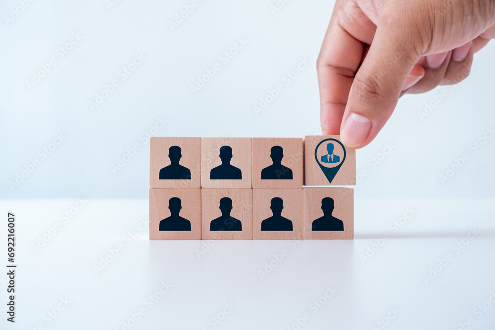 Wooden cube blocks with focused on target customer symbols. Customer ...