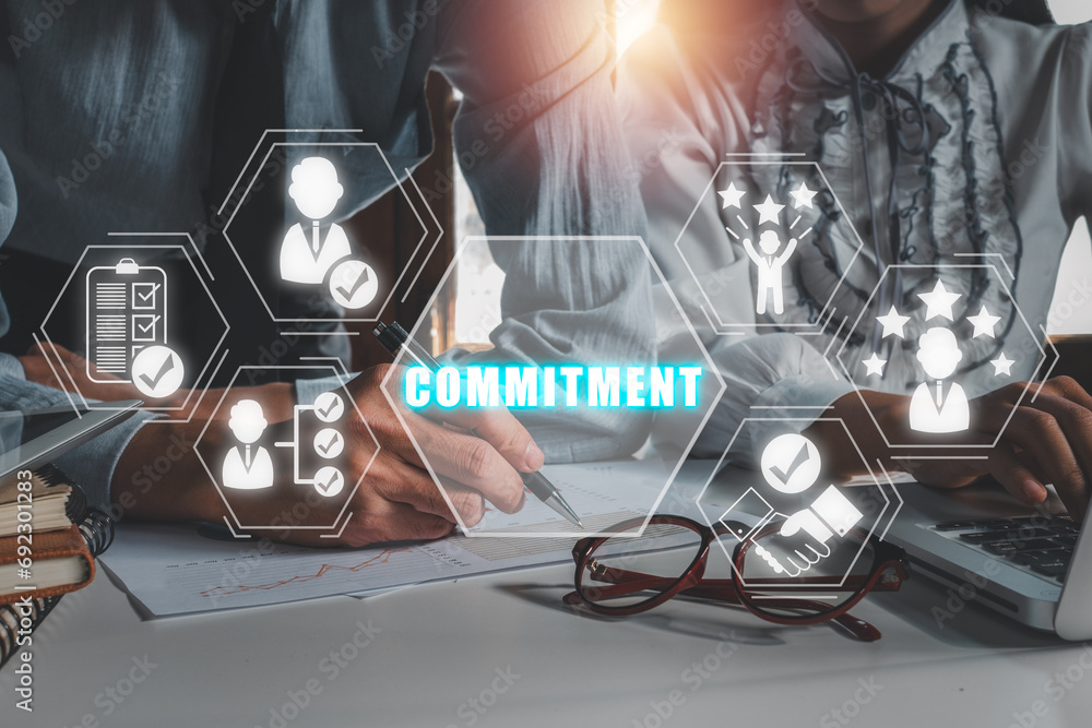 Commitment concept, Business team analyzing income charts and graphs on ...