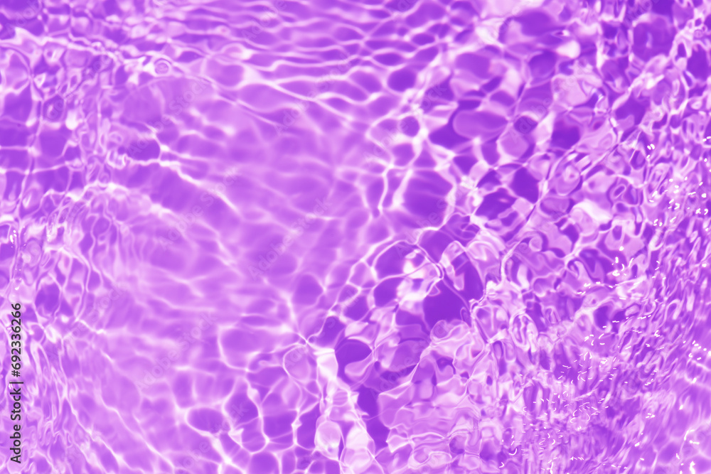 Purple water bubbles on the surface ripples. Defocus blurred ...
