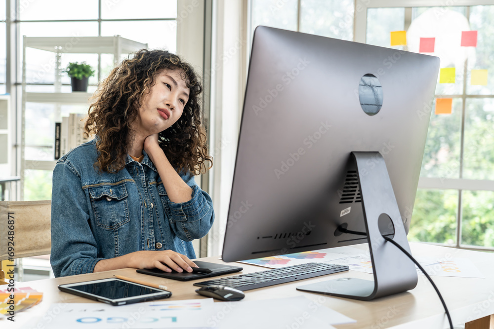 Tired fatigued asian girl feel neck discomfort with computer work in ...