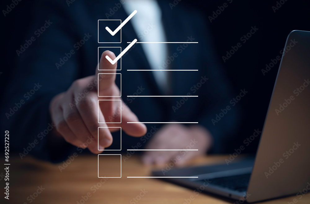 Check list concept.Businessman using laptop with online checklist ...