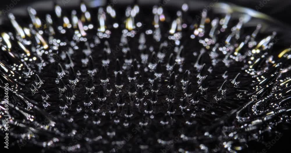 Magnetic fluid. Ferro fluid. Black liquid surface. Abstract background ...