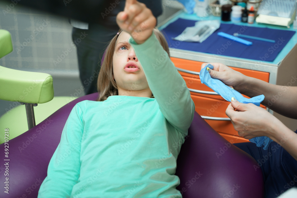Little scared girl sitting in chair in dentist doctor office. Kid,child ...