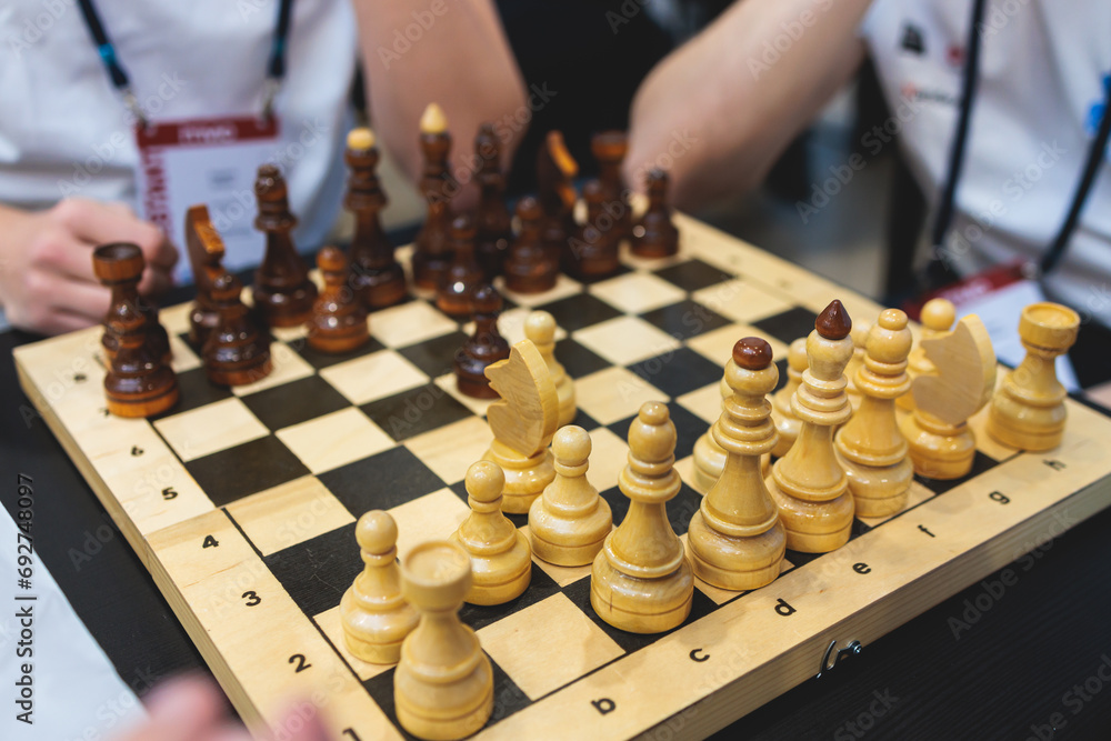 Chess tournament, kids and adults participate in chess match game ...