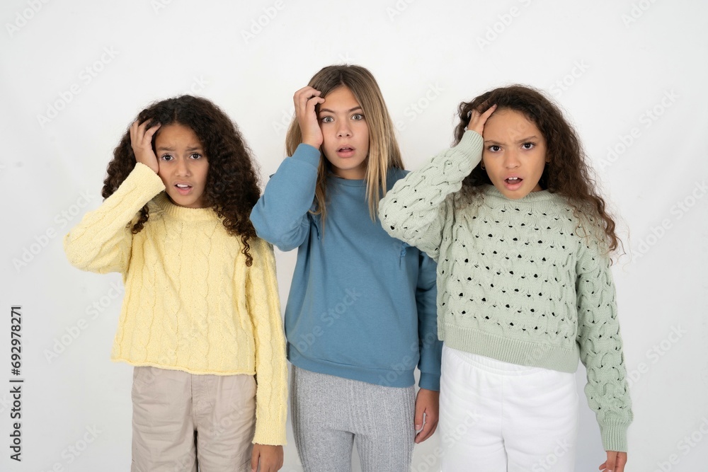 Embarrassed multi racial group of girl friends with shocked expression ...