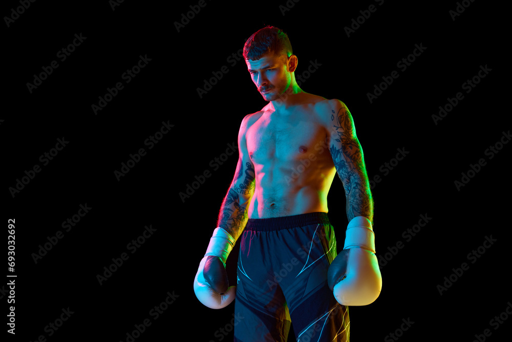 Young man with muscular strong shirtless body, boxing athlete standing ...