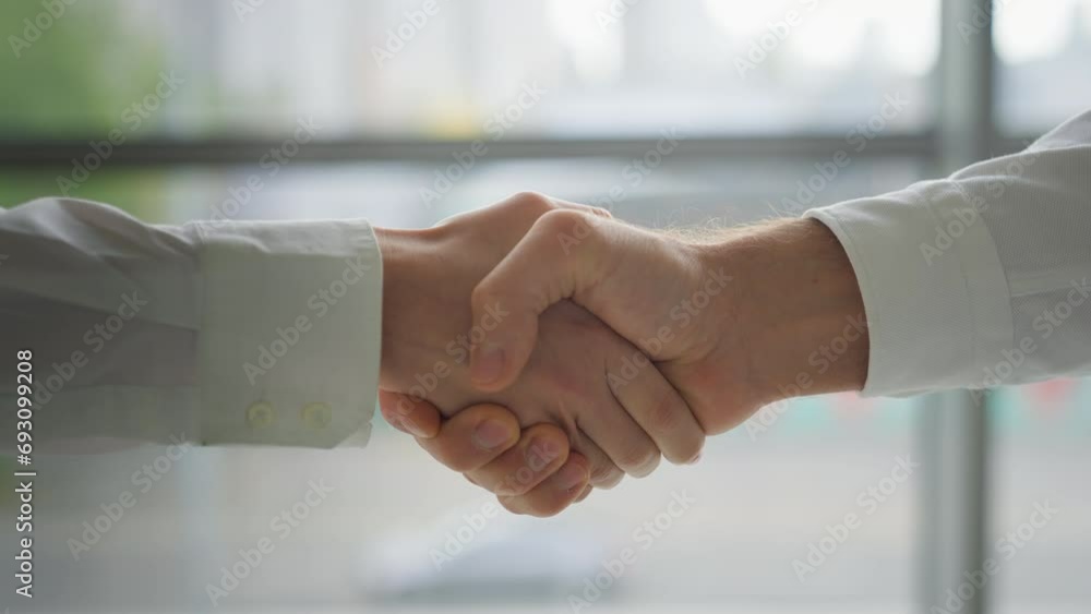 Close up Caucasian hands shaking formal friendly greeting welcome ...