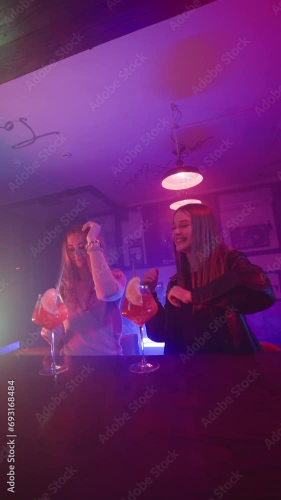 Vertical Video, Two Girlfriends Dance with Cocktails in Their Hands ...