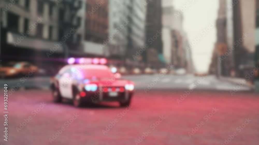 day background blurred the police car flashes bright red and blue ...