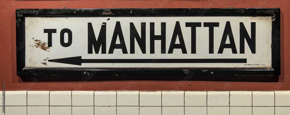 to manhattan subway sign with arrow (old fashioned, antique, vintage ...