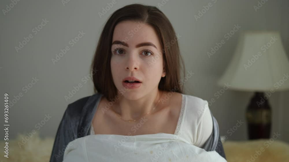 Close Up The Girl Wakes Up And Quickly Sits On The Bed And Realizes