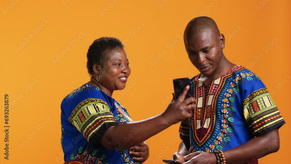 Happy african american people scrolling webpages on smartphone ...