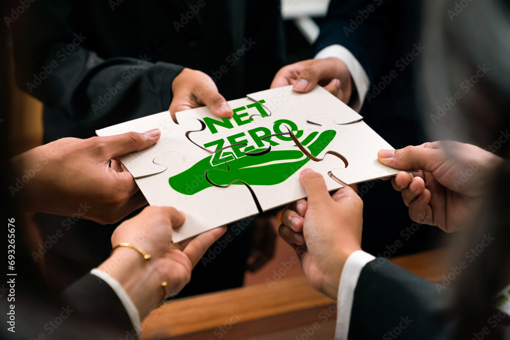 Cohesive group of business people forming jigsaw puzzle pieces in net ...