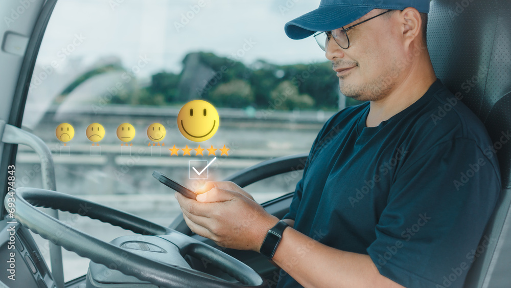Truck driver man hand using smartphone with popup five star icon for ...