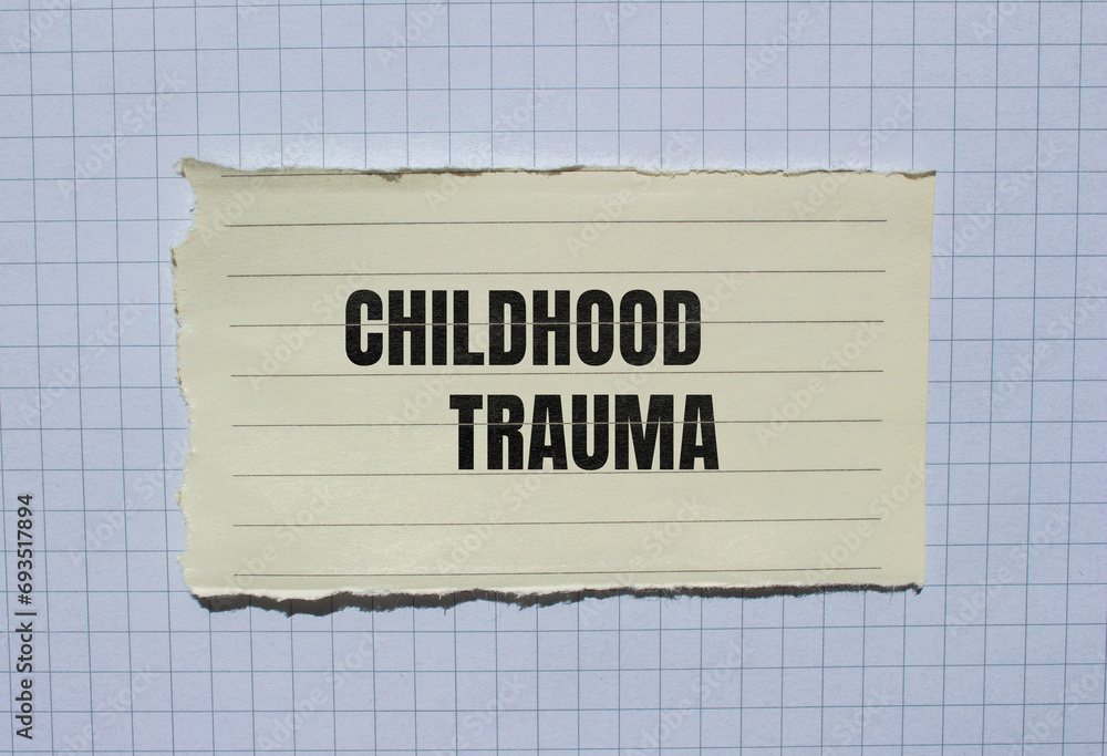 Childhood trauma lettering on ripped paper. Conceptual photo. Stock ...
