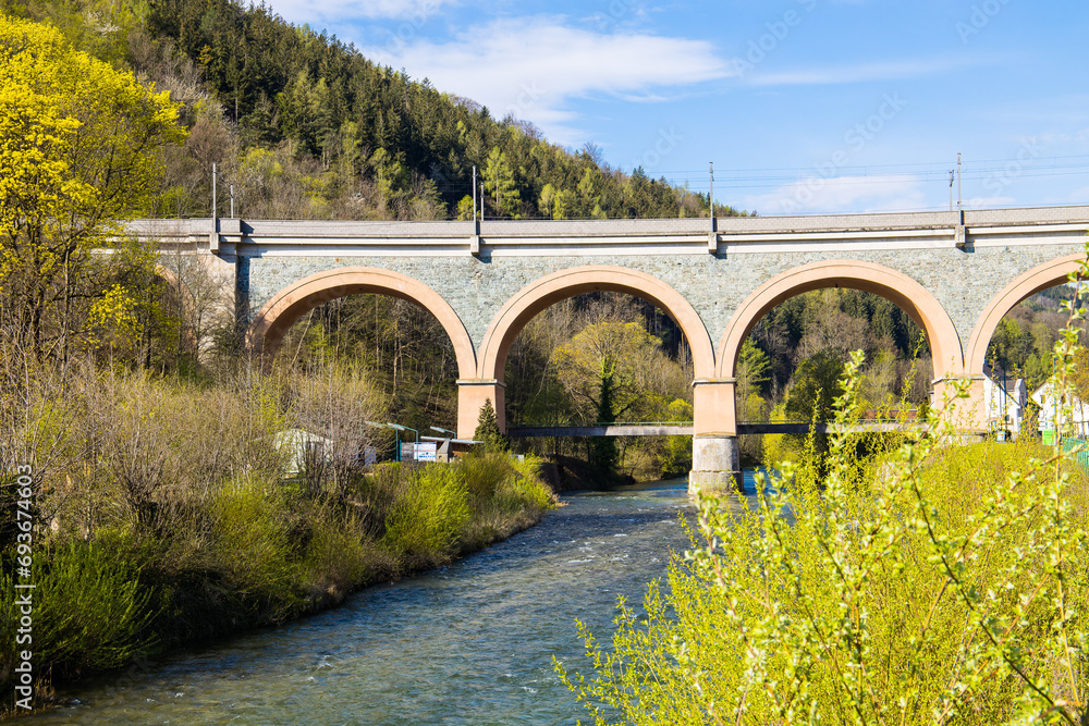 Historical railway viaduct over river Schwarza in Payerbach, Austria as ...